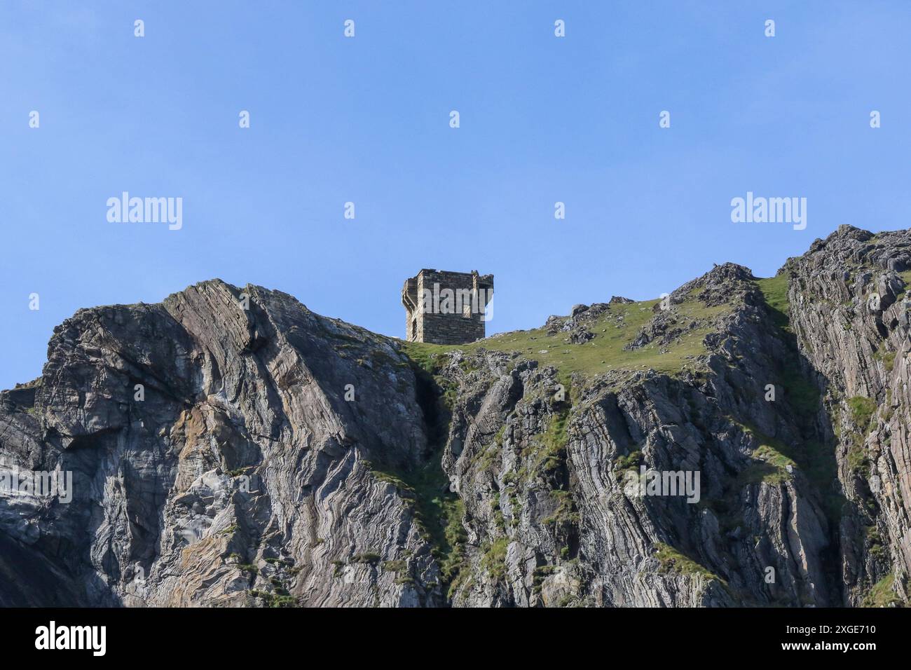 Quarztite rock sea cliff ireland with Napoleonic signal tower Carrigan ...