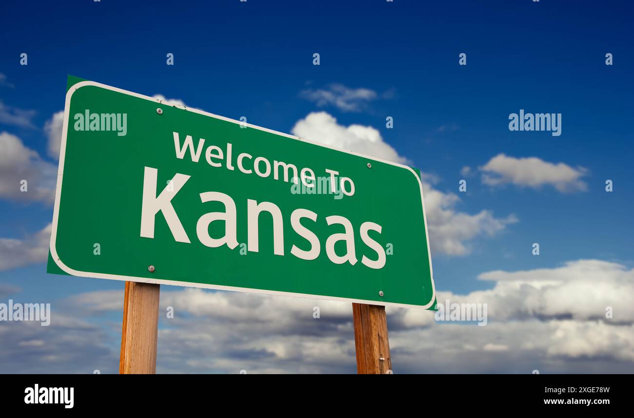 Welcome To Kansas Green Road Sign Over Blue Sky with Some Clouds Stock ...