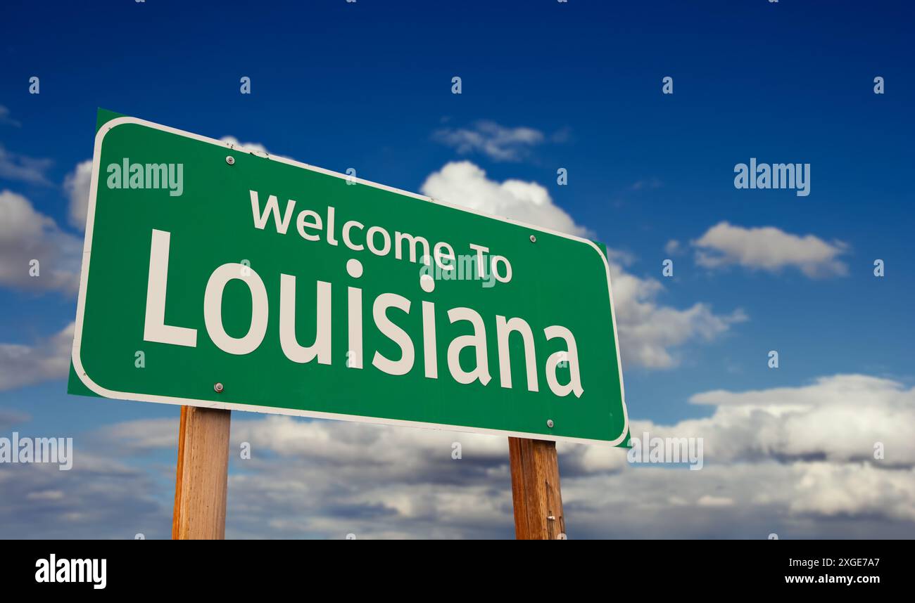 Welcome To Louisiana Green Road Sign Over Blue Sky with Some Clouds ...