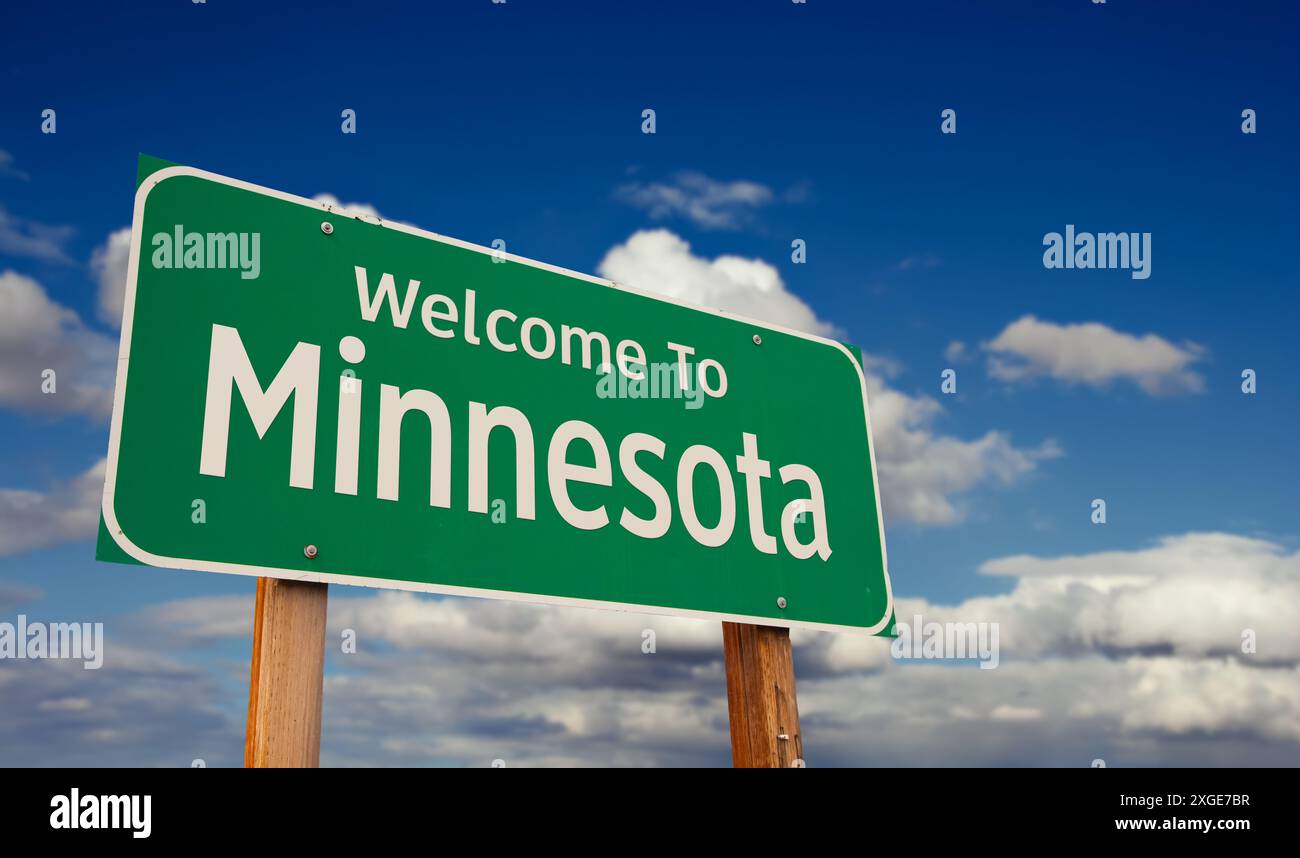 Welcome To Minnesota Green Road Sign Over Blue Sky with Some Clouds ...