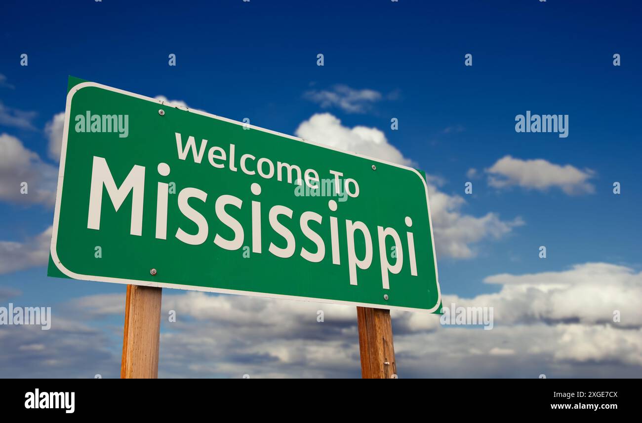 Welcome To Mississippi Green Road Sign Over Blue Sky with Some Clouds ...