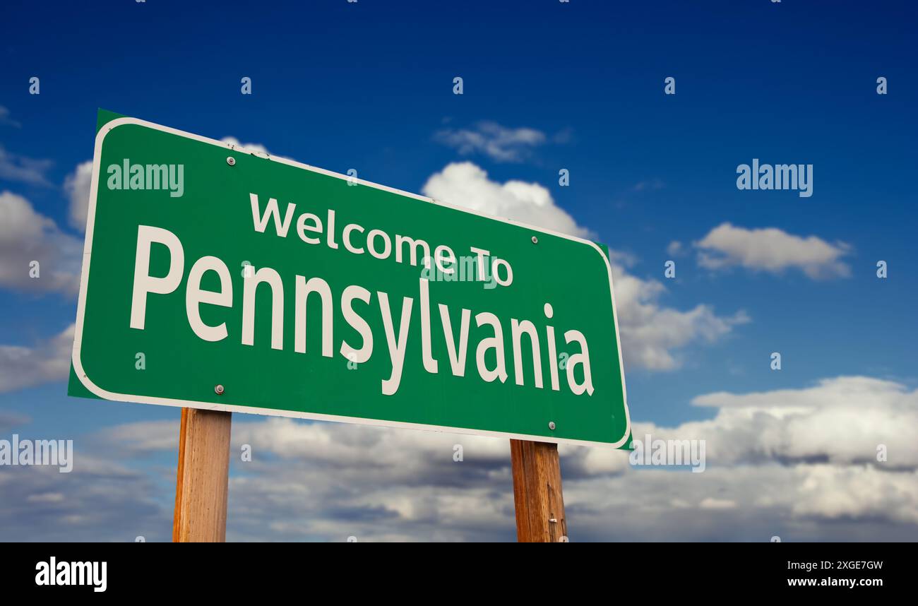 Welcome To Pennsylvania Green Road Sign Over Blue Sky with Some Clouds ...