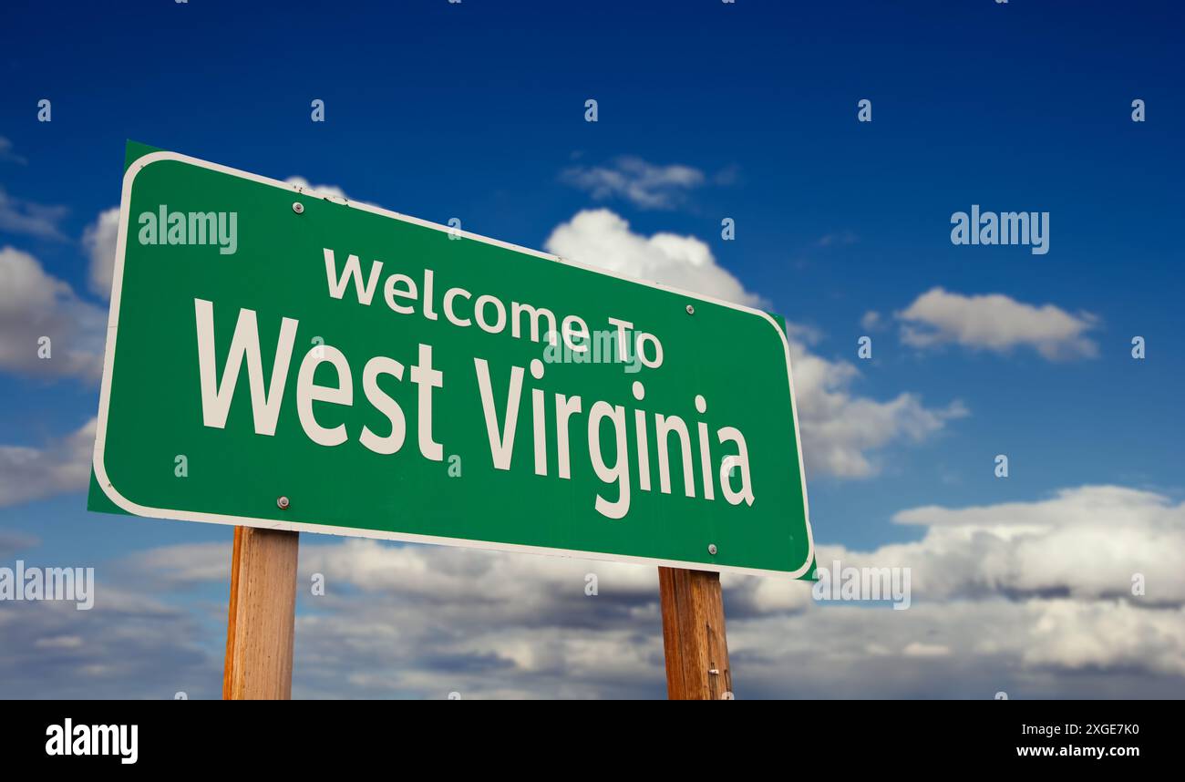 Welcome To West Virginia Green Road Sign Over Blue Sky with Some Clouds Stock Photo - Alamy