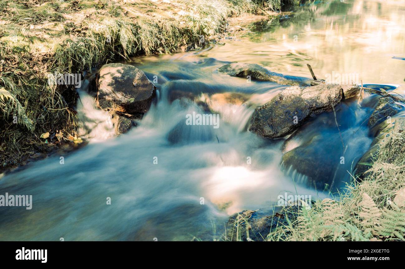 Faded old image effect white water tumbling over rocky drop in stream ...