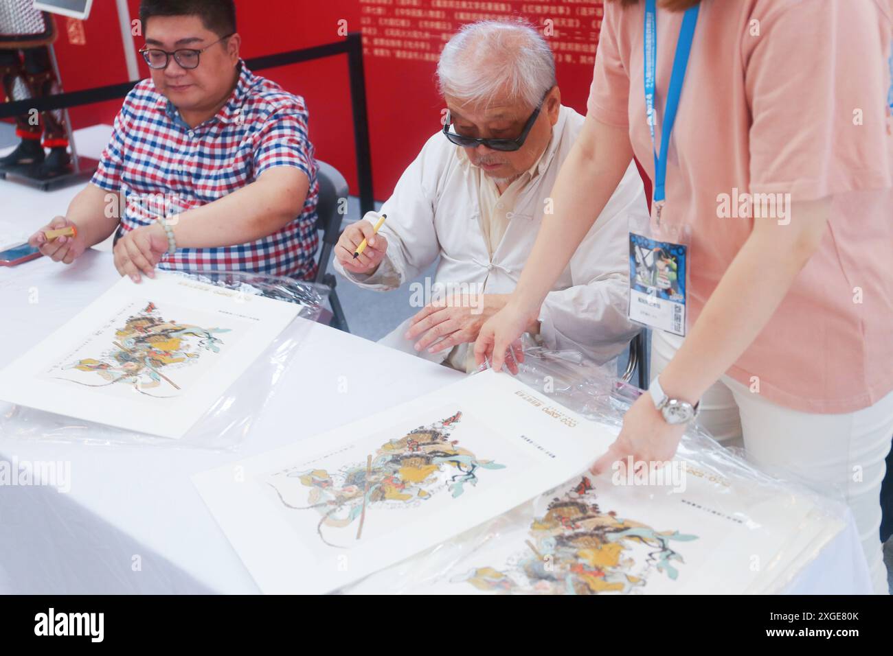 SHANGHAI, CHINA - JULY 6, 2024 - Artist Dai Dunbang, 87, signs his ...