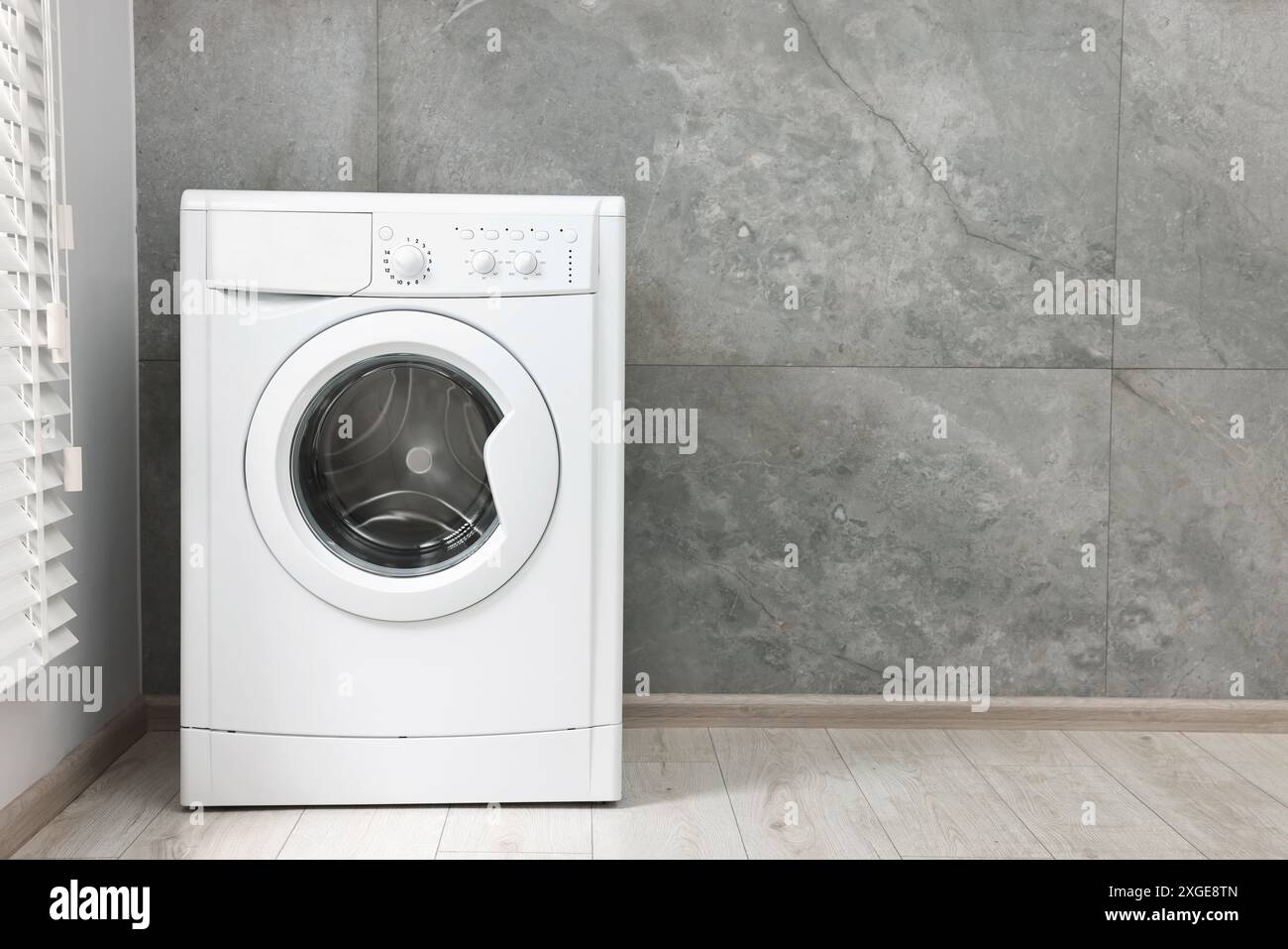 One washing machine in laundry room, space for text Stock Photo - Alamy