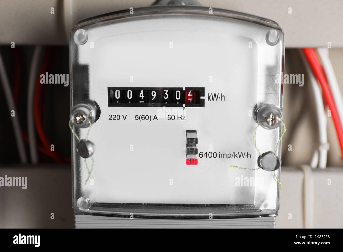 Electric meter and wires in fuse box, closeup. Energy measuring device ...
