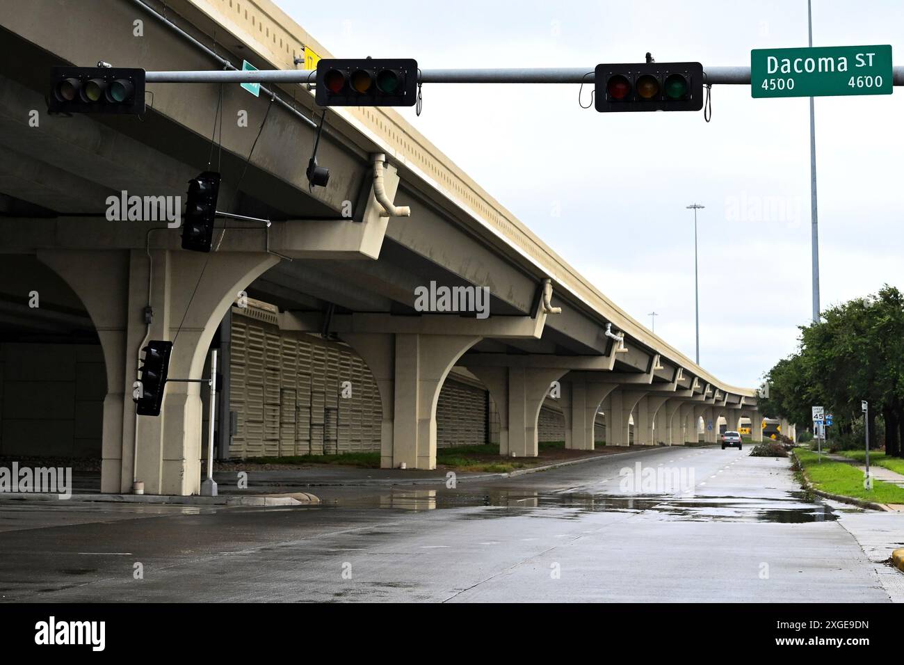 Fallen debris litter the underpass at a traffic signal in Houston, on ...