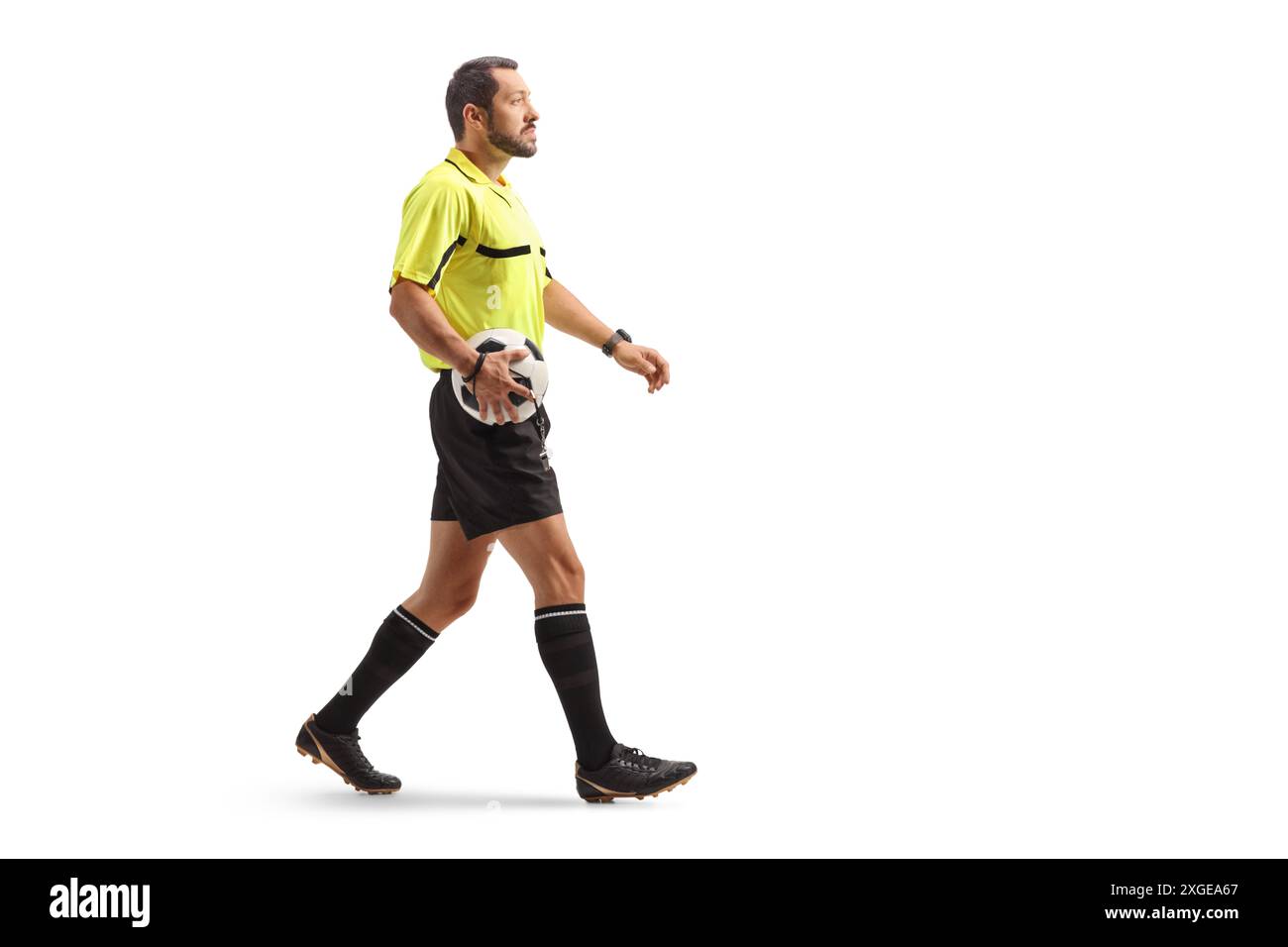 Football referee walking with ball under arm isolated on white ...