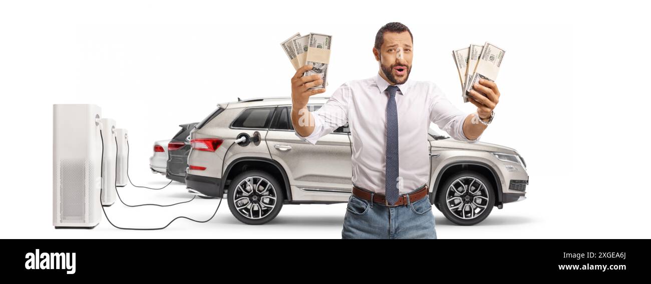 Man holding money in front of electric vehicles isolated on white ...
