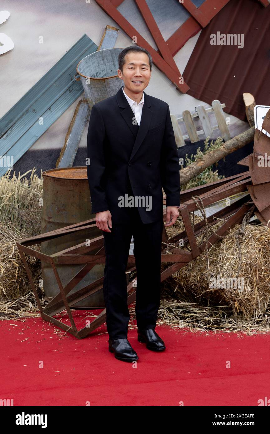 Director Lee Isaac Chung arrives at the premiere of 'Twisters' on ...