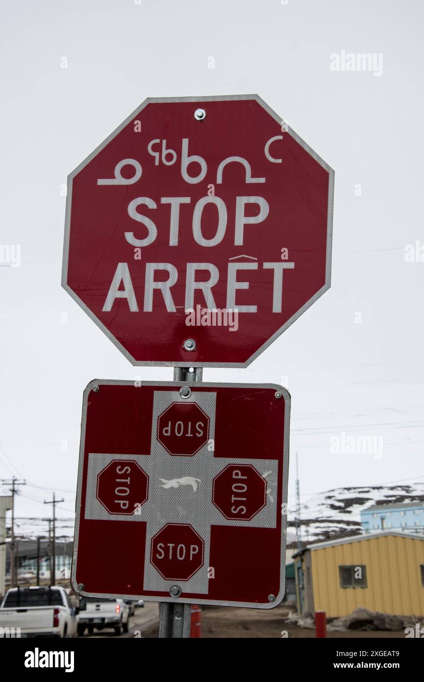 Multilingual stop sign in English, French and Inuktitut at the Four ...