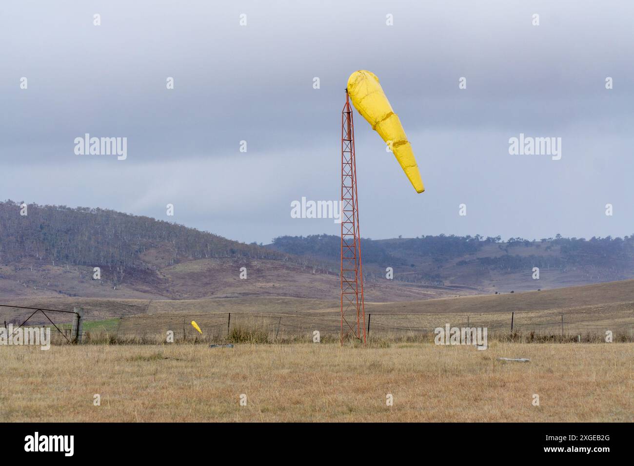 Light Aircraft airfield Yellow wind sock on a overcast winters day ...