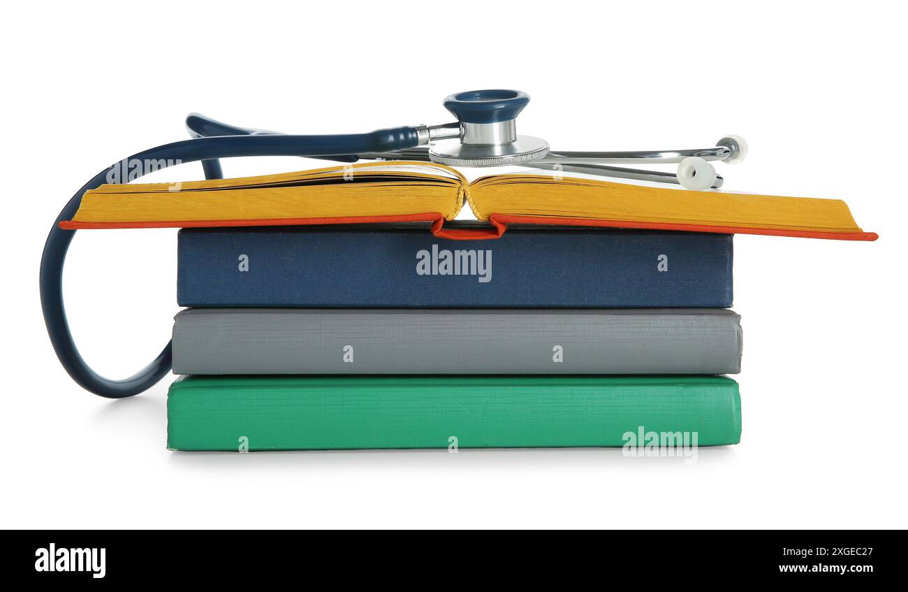 Stethoscope on stack of books against white background Stock Photo - Alamy