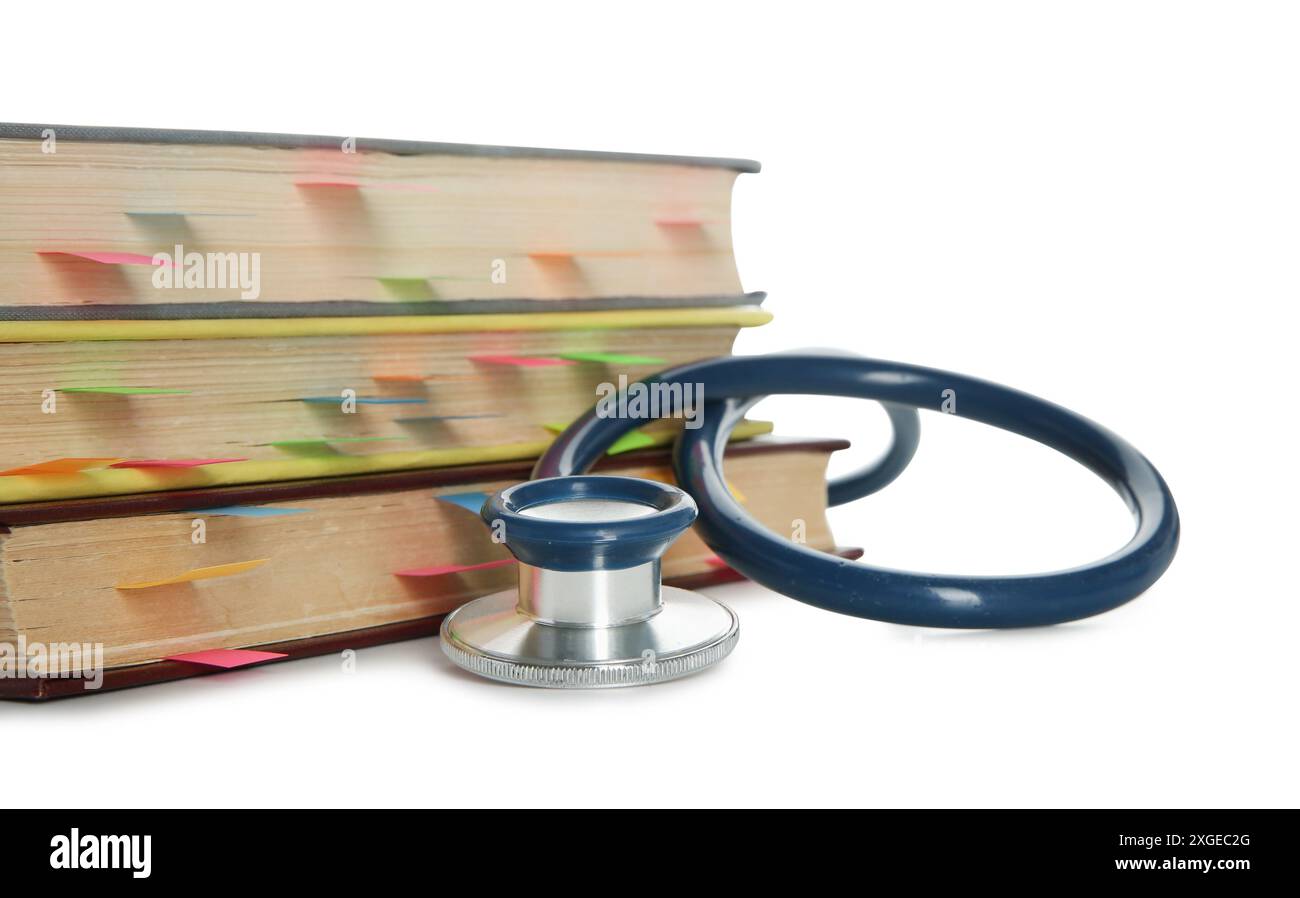 Stethoscope and stack of books isolated on white Stock Photo - Alamy