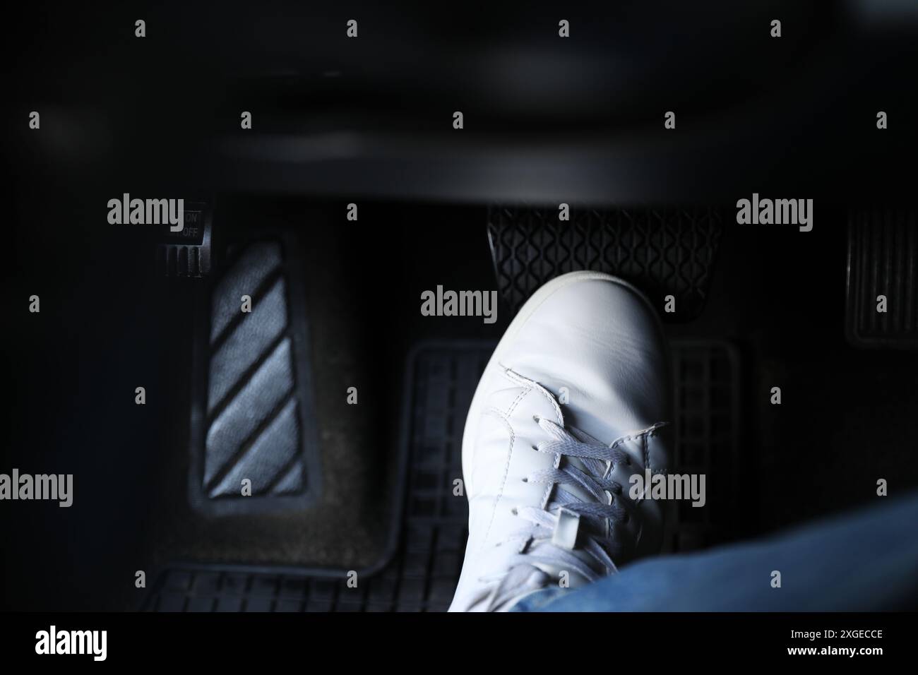 Man pushing on pedal of car brake, closeup Stock Photo - Alamy