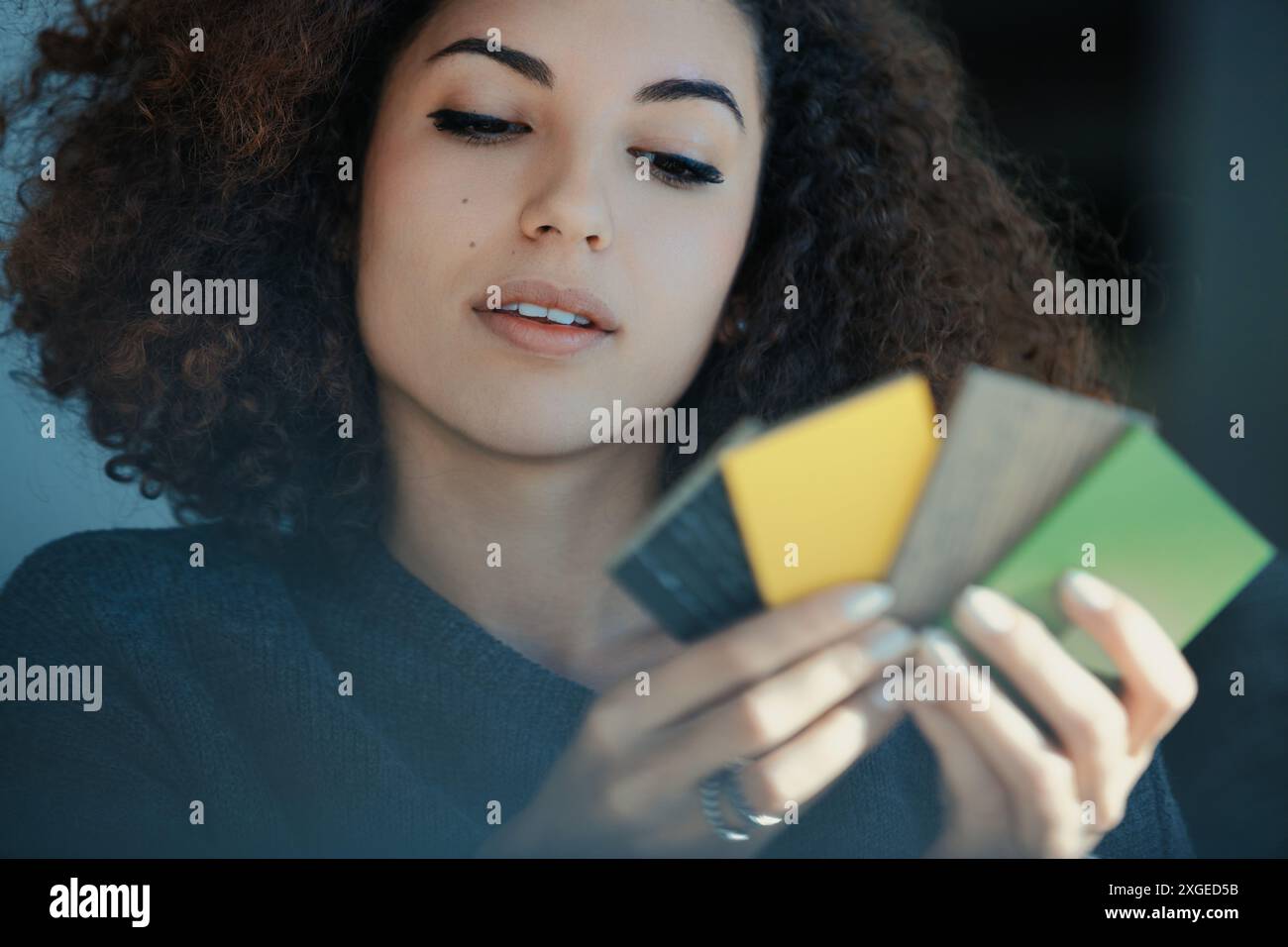 Woman examines design samples in hi-res stock photography and images - Alamy