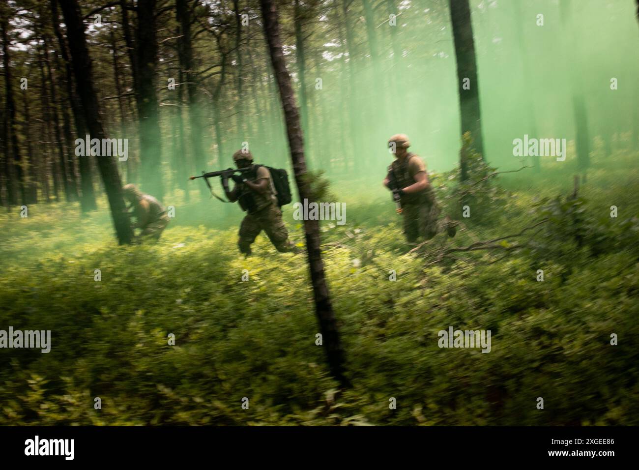 U.S. Army Soldiers react to fire during a situational training exercise ...