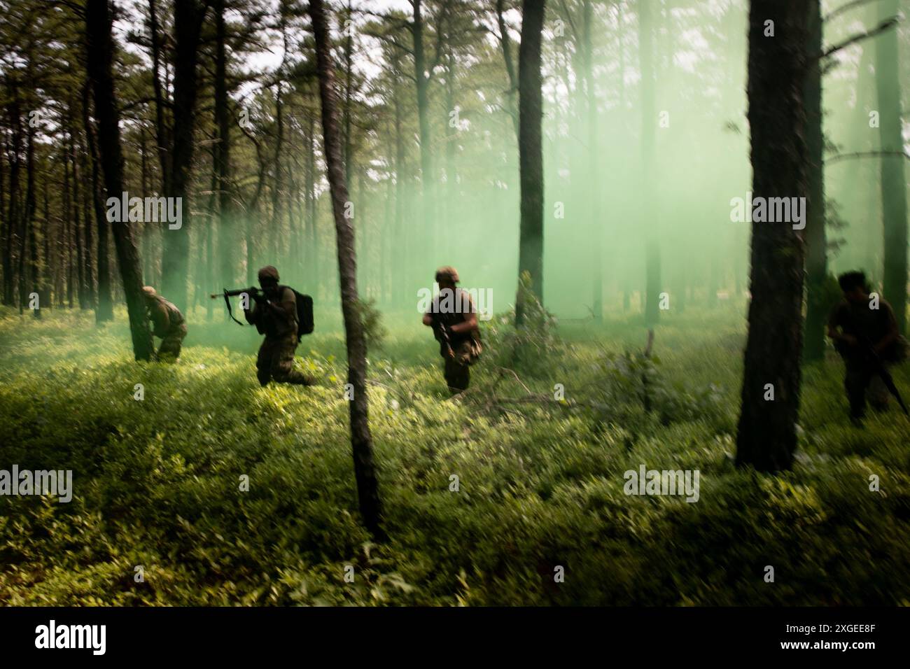 U.S. Army Soldiers react to fire during a situational training exercise ...