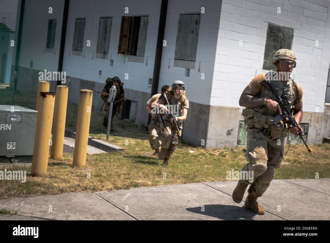 U.S. Army Soldiers react to fire during a situational training exercise ...