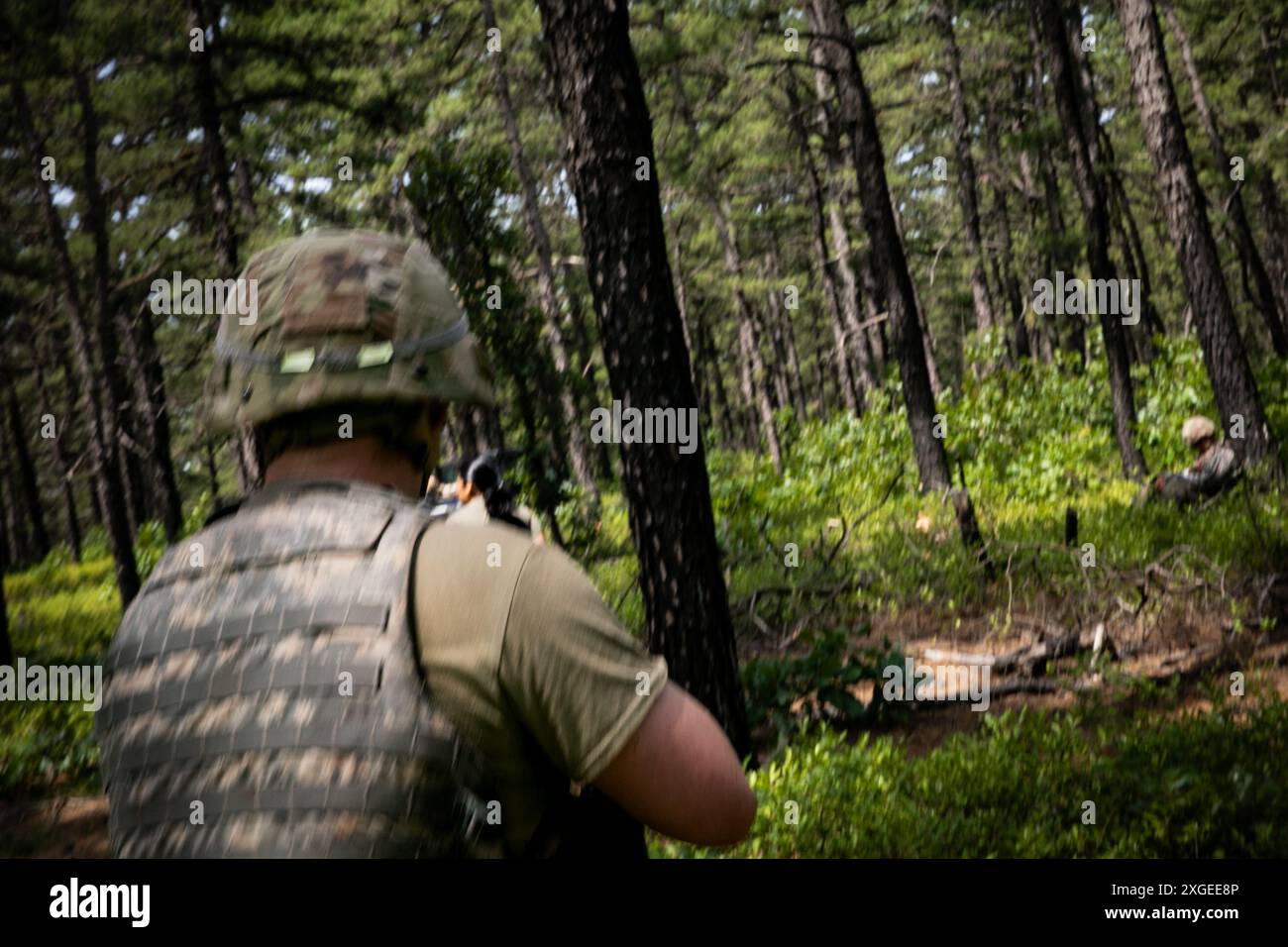 U.S. Army Soldiers react to fire during a situational training exercise ...