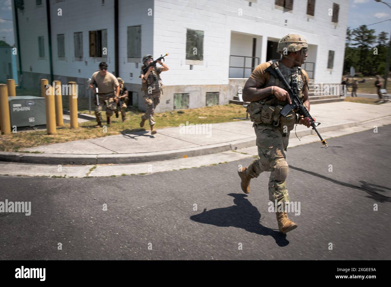 U.S. Army Soldiers react to fire during a situational training exercise ...