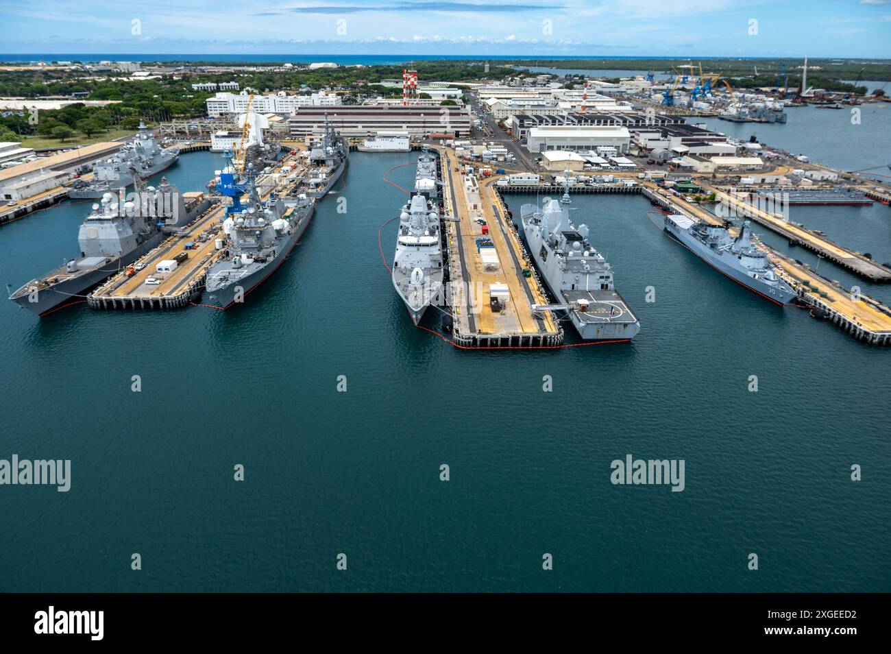 An aerial view of ships from multiple nations moored at Joint Base ...