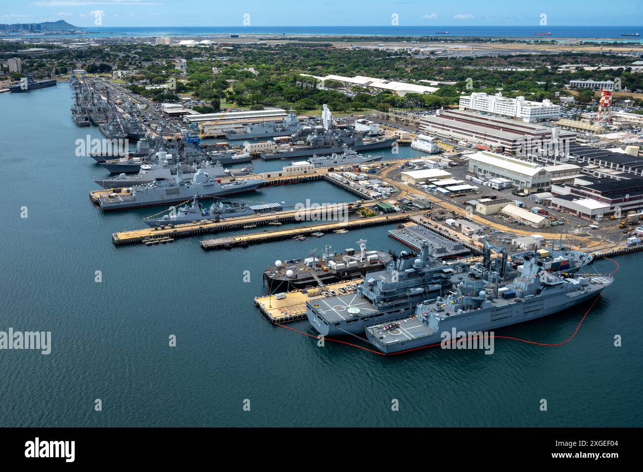 An aerial view of ships from multiple nations moored at Joint Base ...