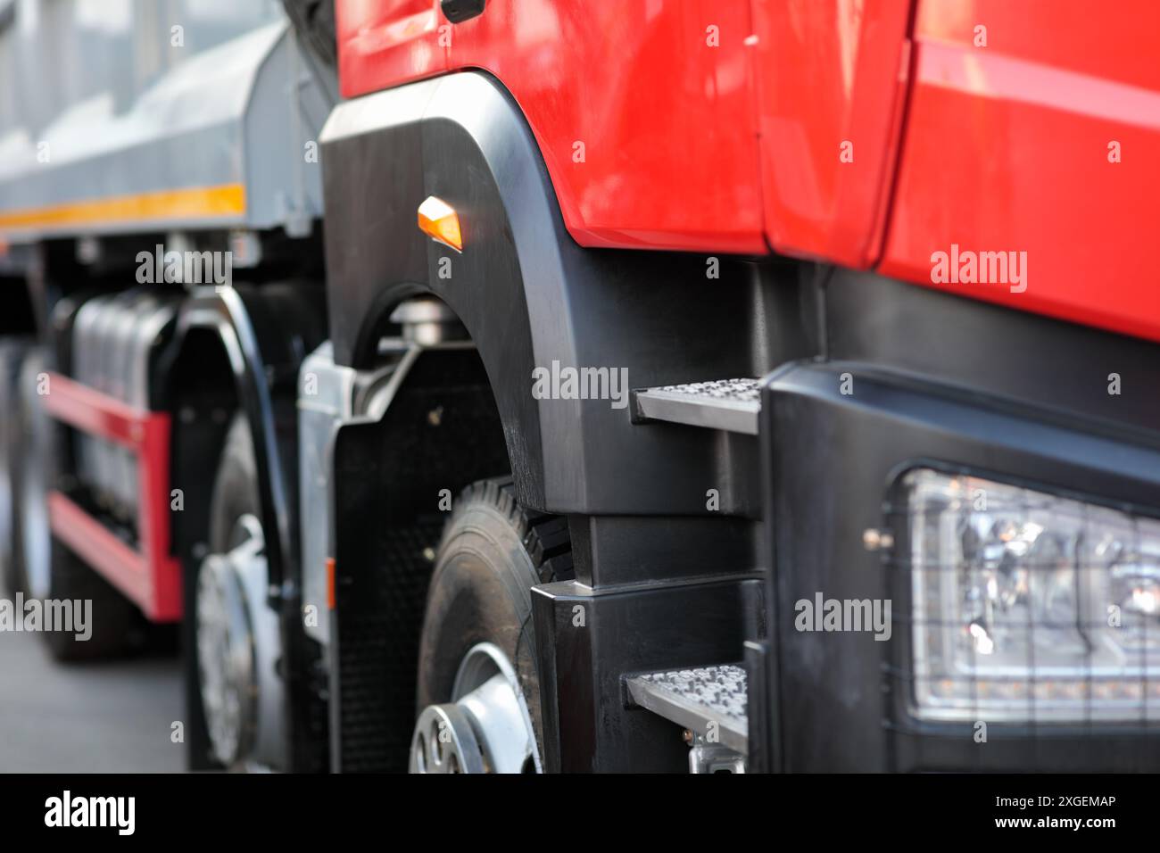 Close-up side view of a four axle dump truck. Selective focus Stock ...