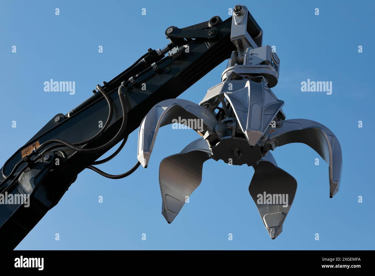 Excavator arm with metal scrap grabber. Excavator orange peel grapple ...