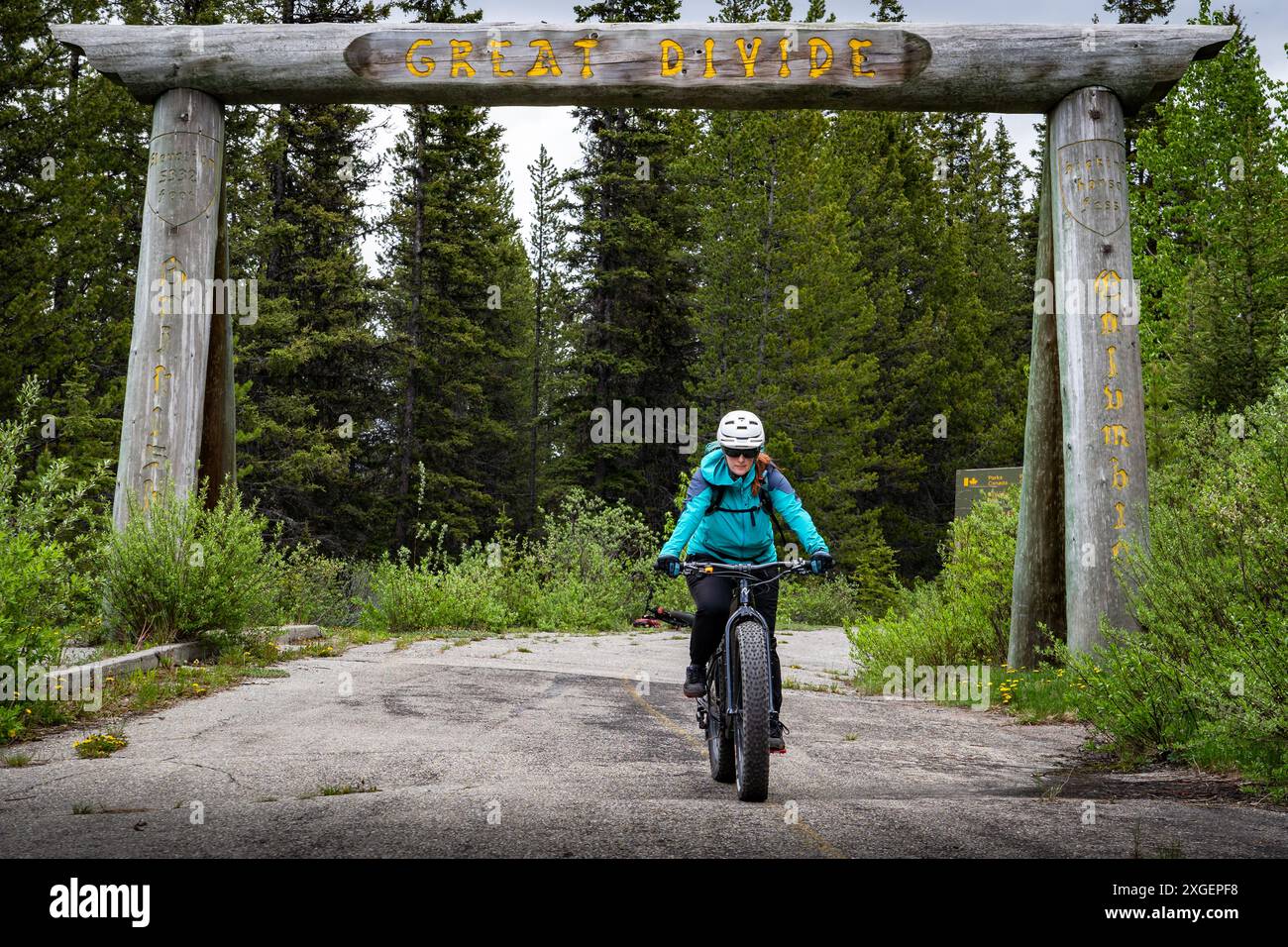 Banff National Park Alberta, June 24 2024: Cyclist passes under the old ...