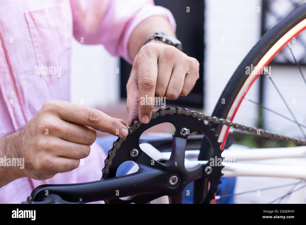 Repairing bicycle chain, man adjusting gear mechanism outdoors ...