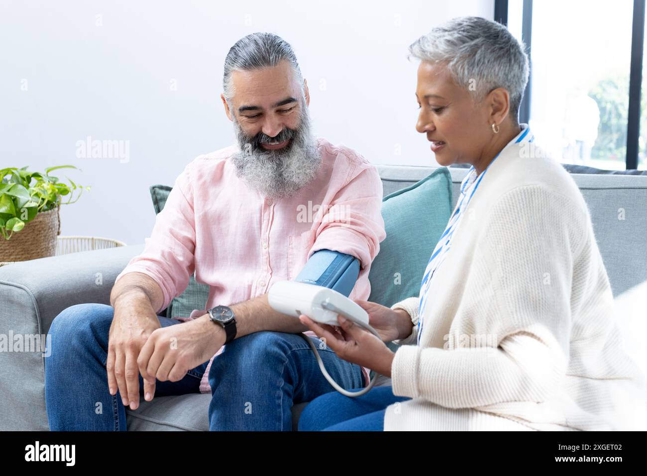 Doctor checking pulse on patient hi-res stock photography and images ...