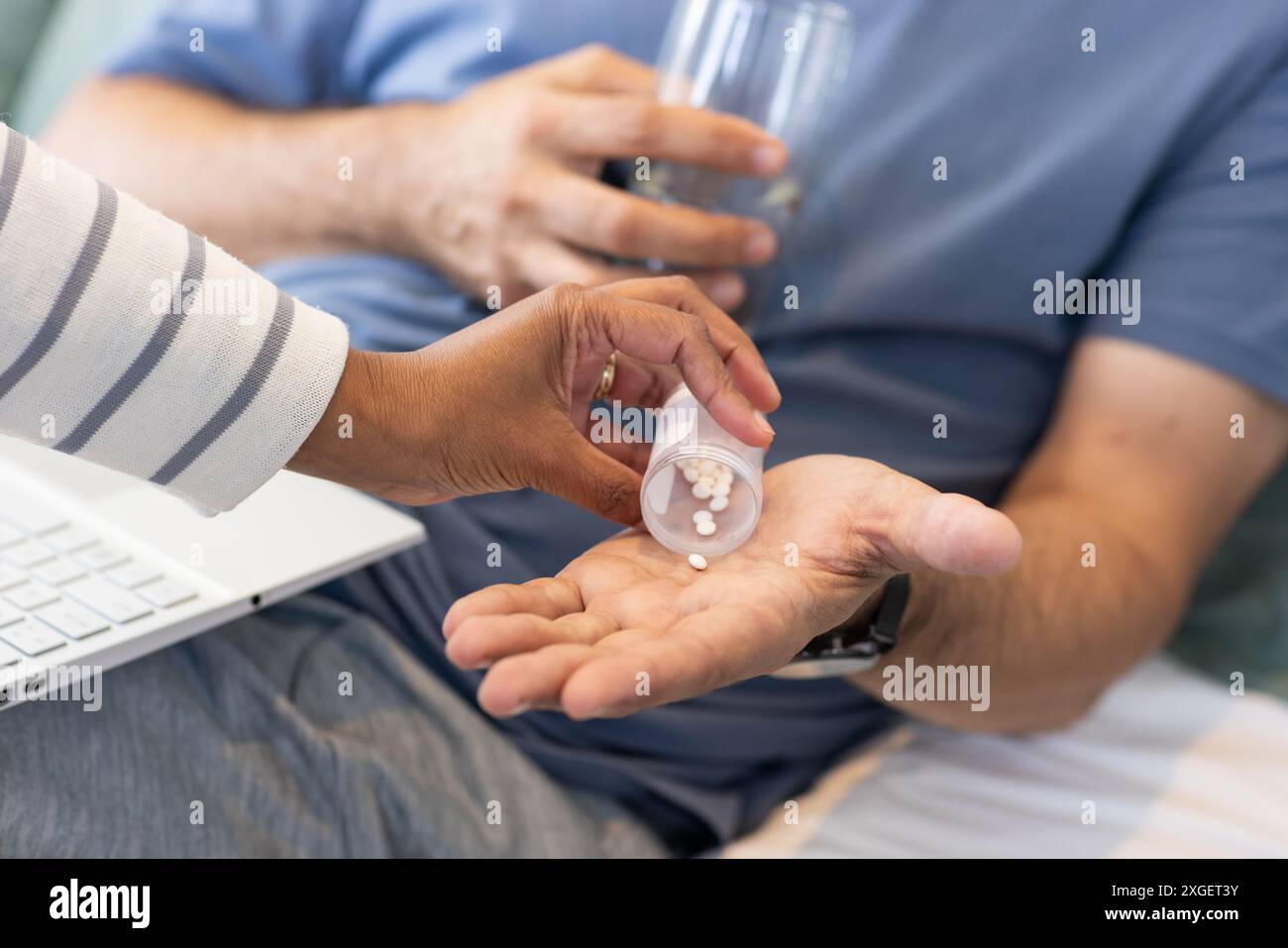 Caregiver handing glass water senior hi-res stock photography and images - Alamy