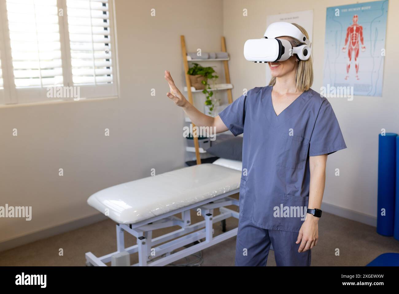 Using VR headset, woman in prosthetic medical clinic practicing virtual reality therapy Stock ...
