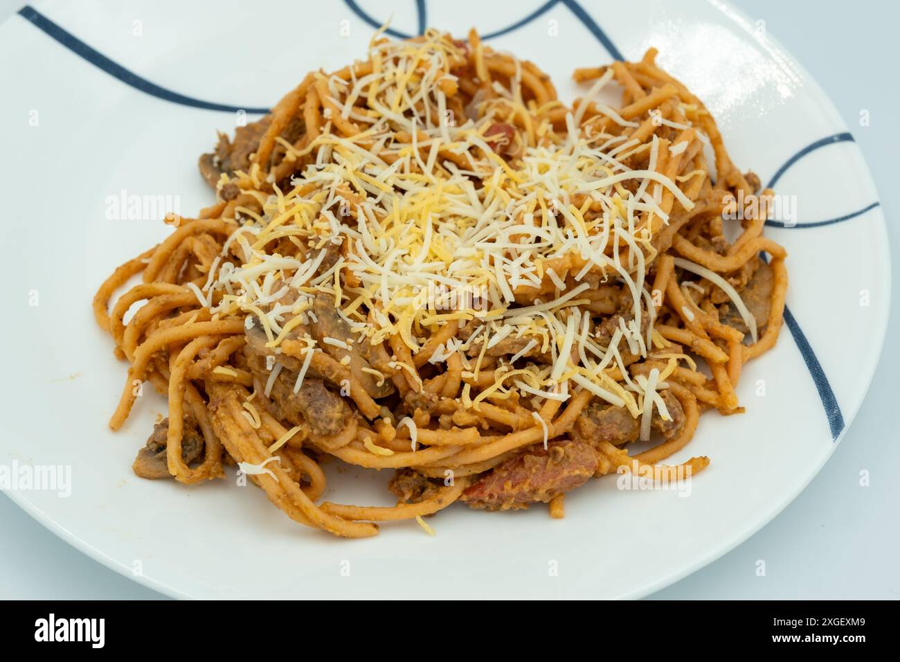 Philippine Sweet Spaghetti with Cheese on top and hotdogs Stock Photo ...