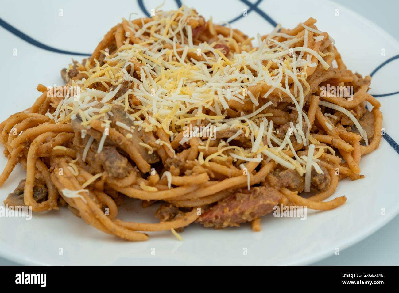 Philippine Sweet Spaghetti with Cheese on top and hotdogs Stock Photo ...