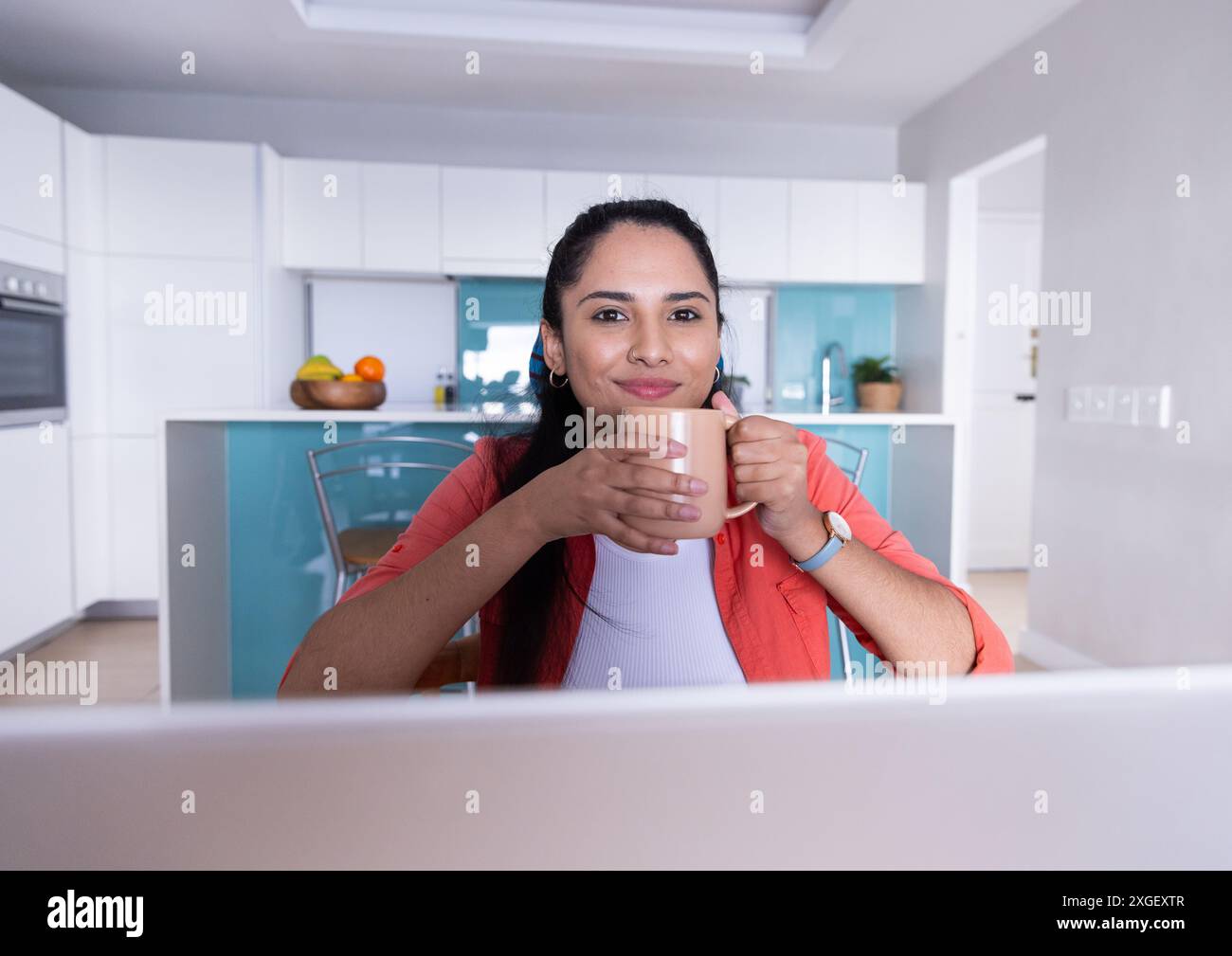 Woman holding laptop multitasking hi-res stock photography and images ...
