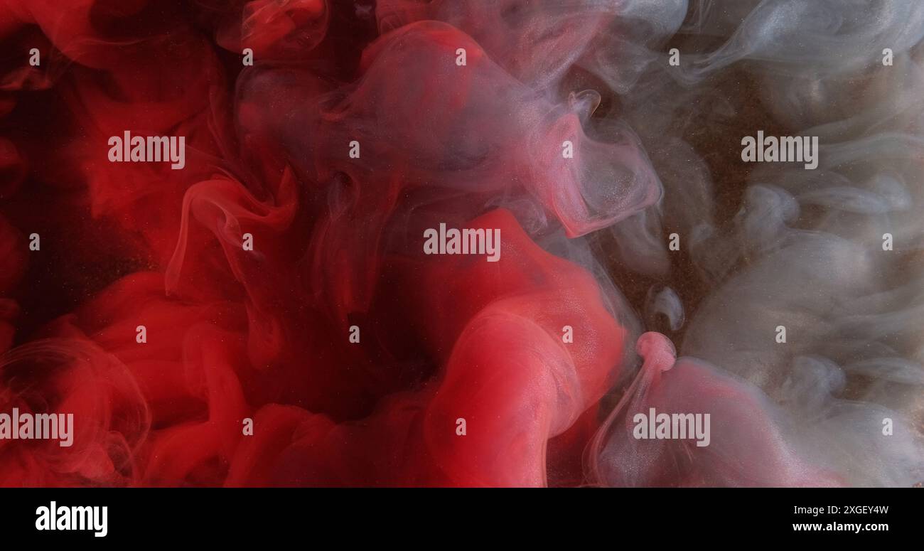 Paint drop water. Color smoke cloud. Defocused red gray ink mix splash ...