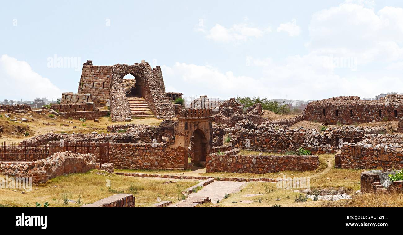 View of the ruined Madarsa and watchtower of Tughlaqabad Fort, 14th ...
