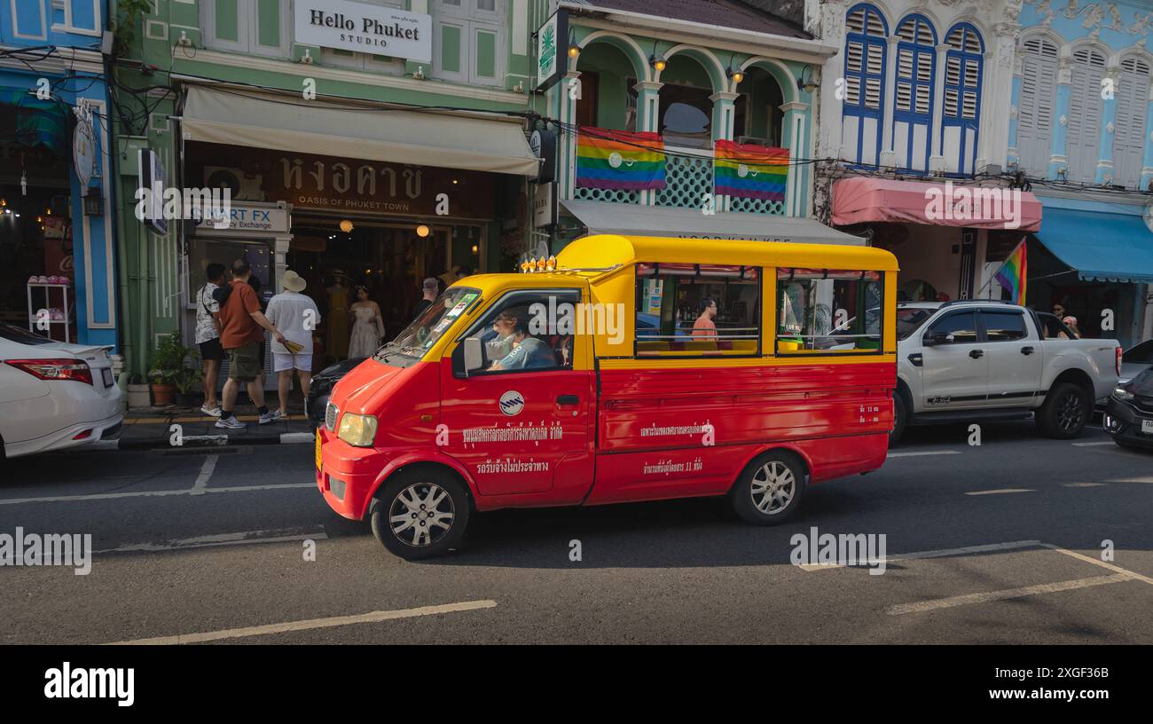Thailand. Phuket local red and yellow color Tuk Tuk local taxi service ...