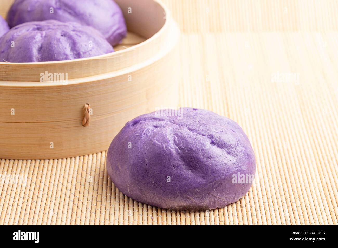 Steamed Purple Ube Sweet Potato Dumplings Stock Photo - Alamy