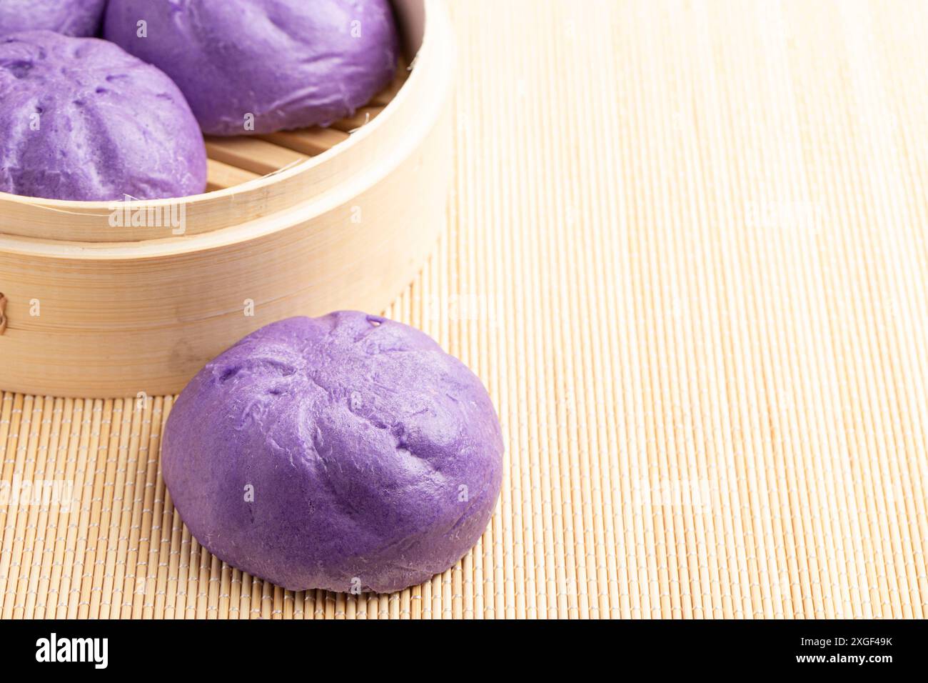 Steamed Purple Ube Sweet Potato Dumplings Stock Photo - Alamy