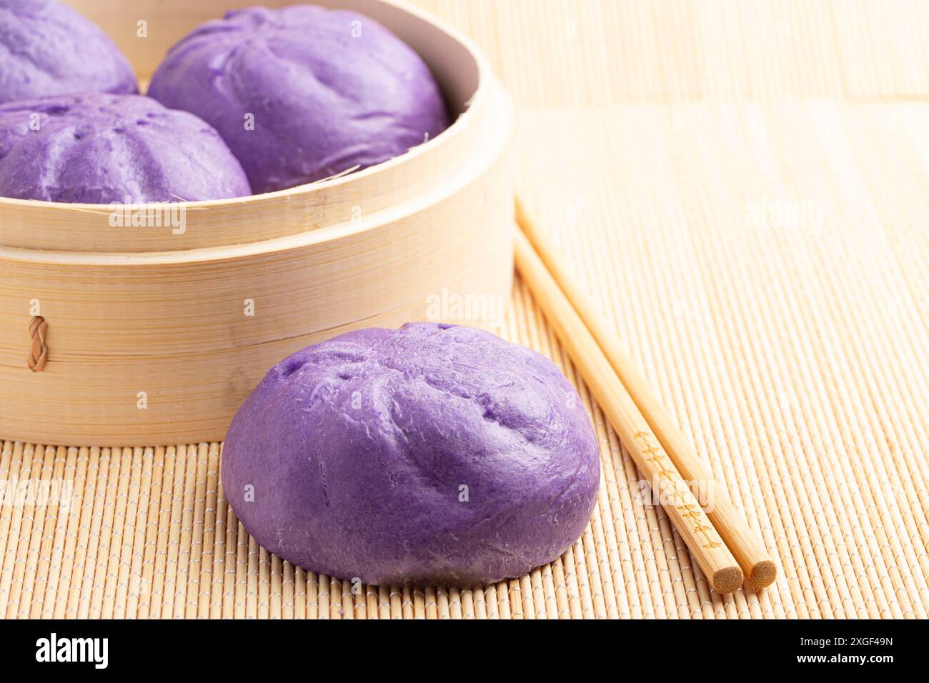 Steamed Purple Ube Sweet Potato Dumplings Stock Photo - Alamy