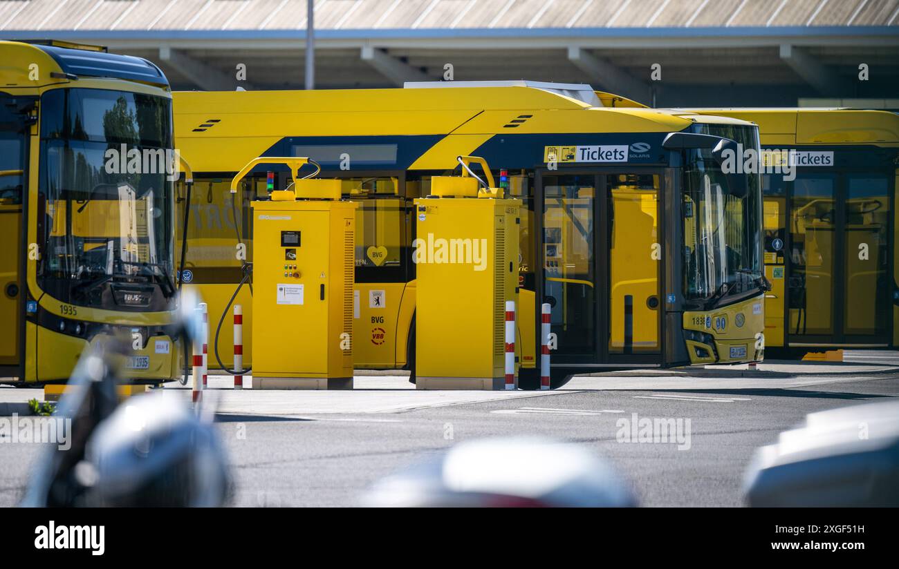 08 July 2024, Berlin: A BVG bus is parked at a charging station in the ...