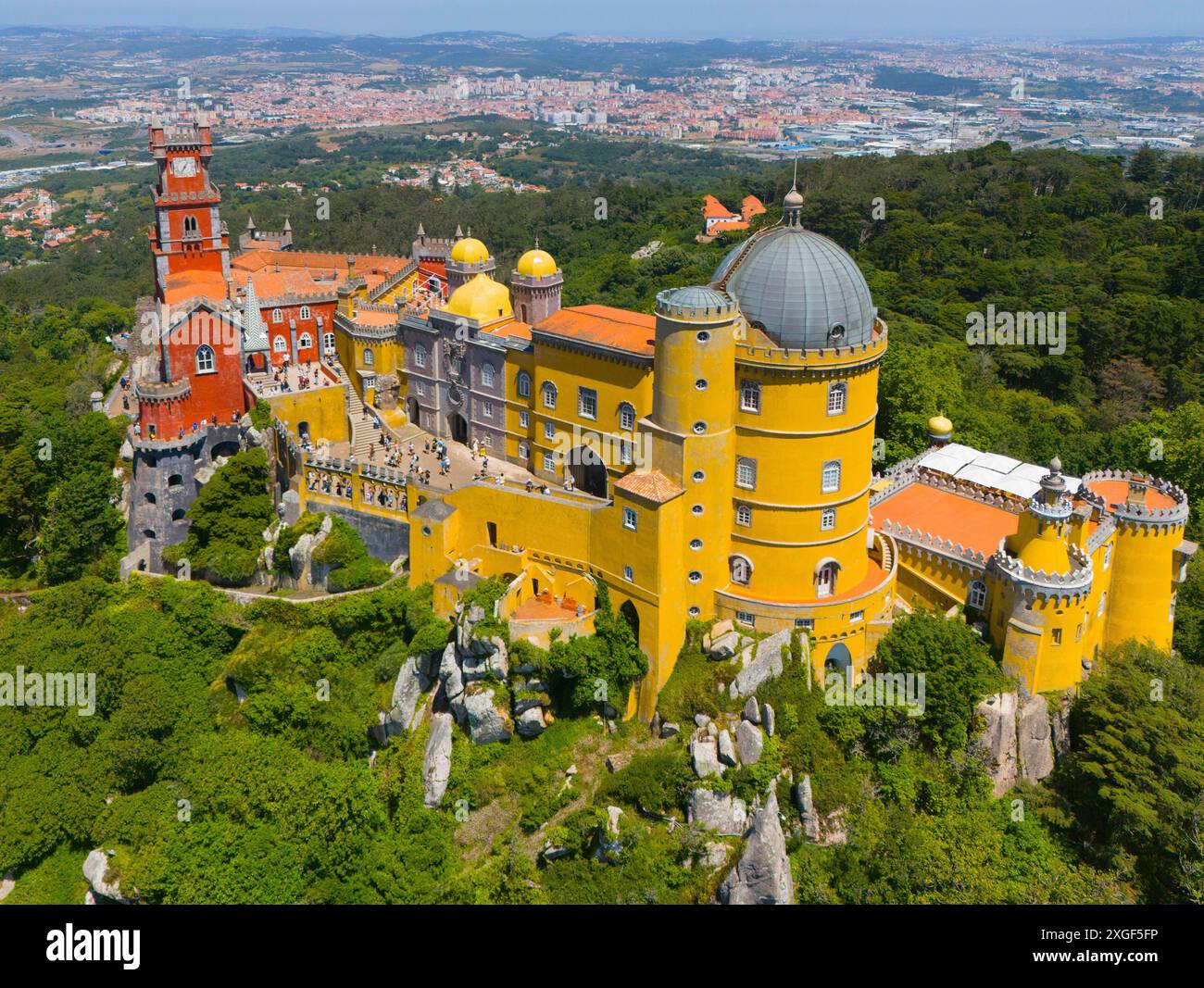 Impressive castle with colourful towers and domed roof on a mountain ...