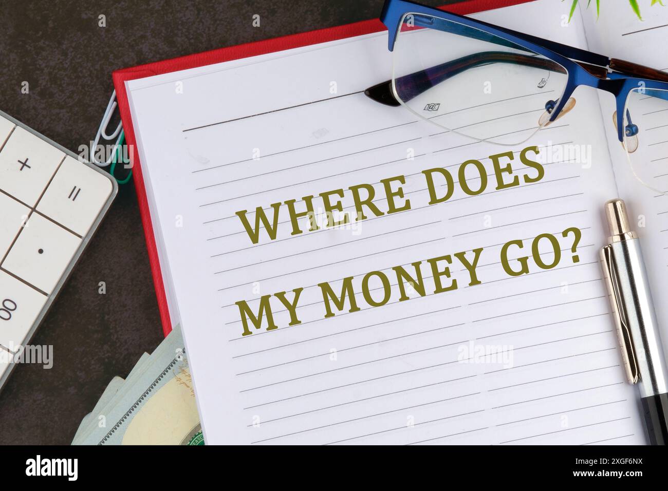 Text written WHERE DOES MY MONEY GO in an open business notebook Stock ...
