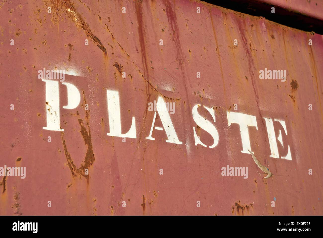 Lettering with the word plastic on a container for collecting plastic ...
