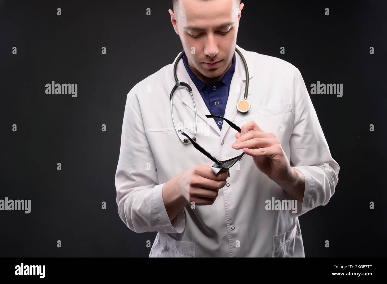 Portrait of unhappy tired young doctor with stethoscope with headache ...