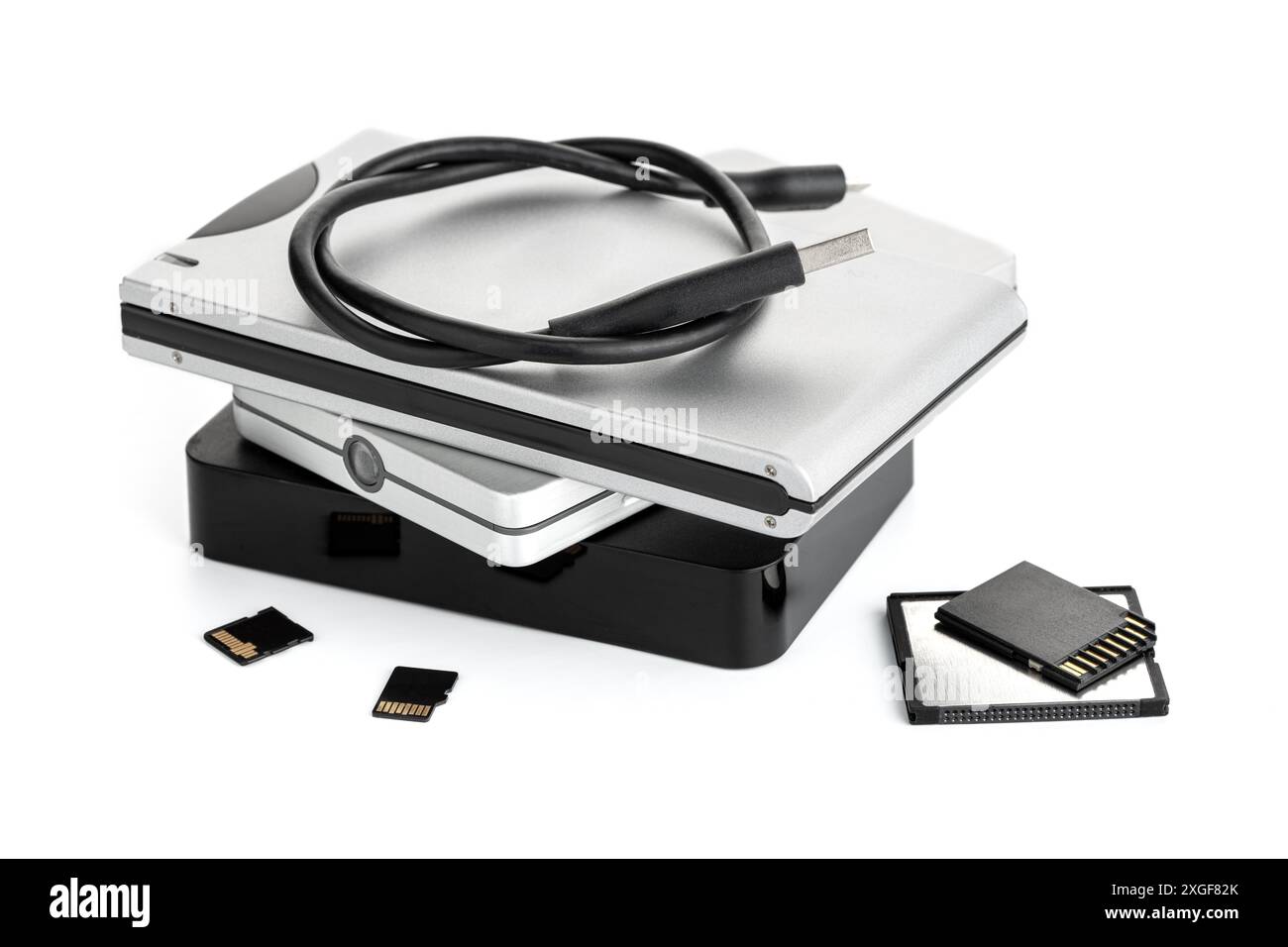 Group of external Hard disks and memory cardsisolated on white ...